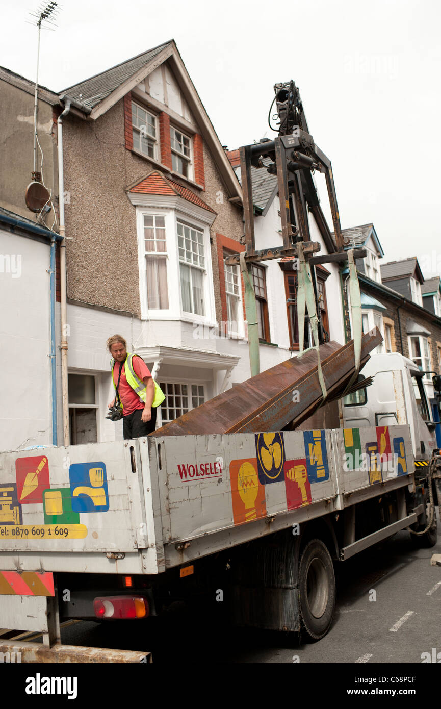 Wolseley builders merchants lorry delivering building supplies to a job ...