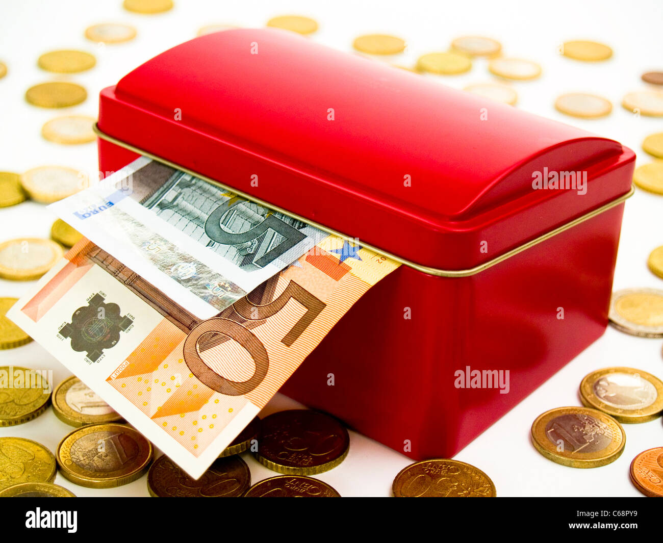 red coffer with Euro banknotes, some coins are in front of this Stock ...