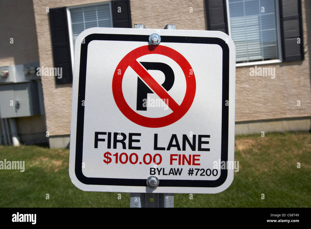 fire lane no parking fine bylaw sign in residential suburb area in ...