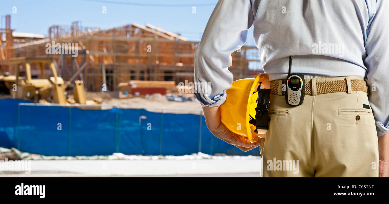 architect engineer with hard hat overlooking construction site Stock ...