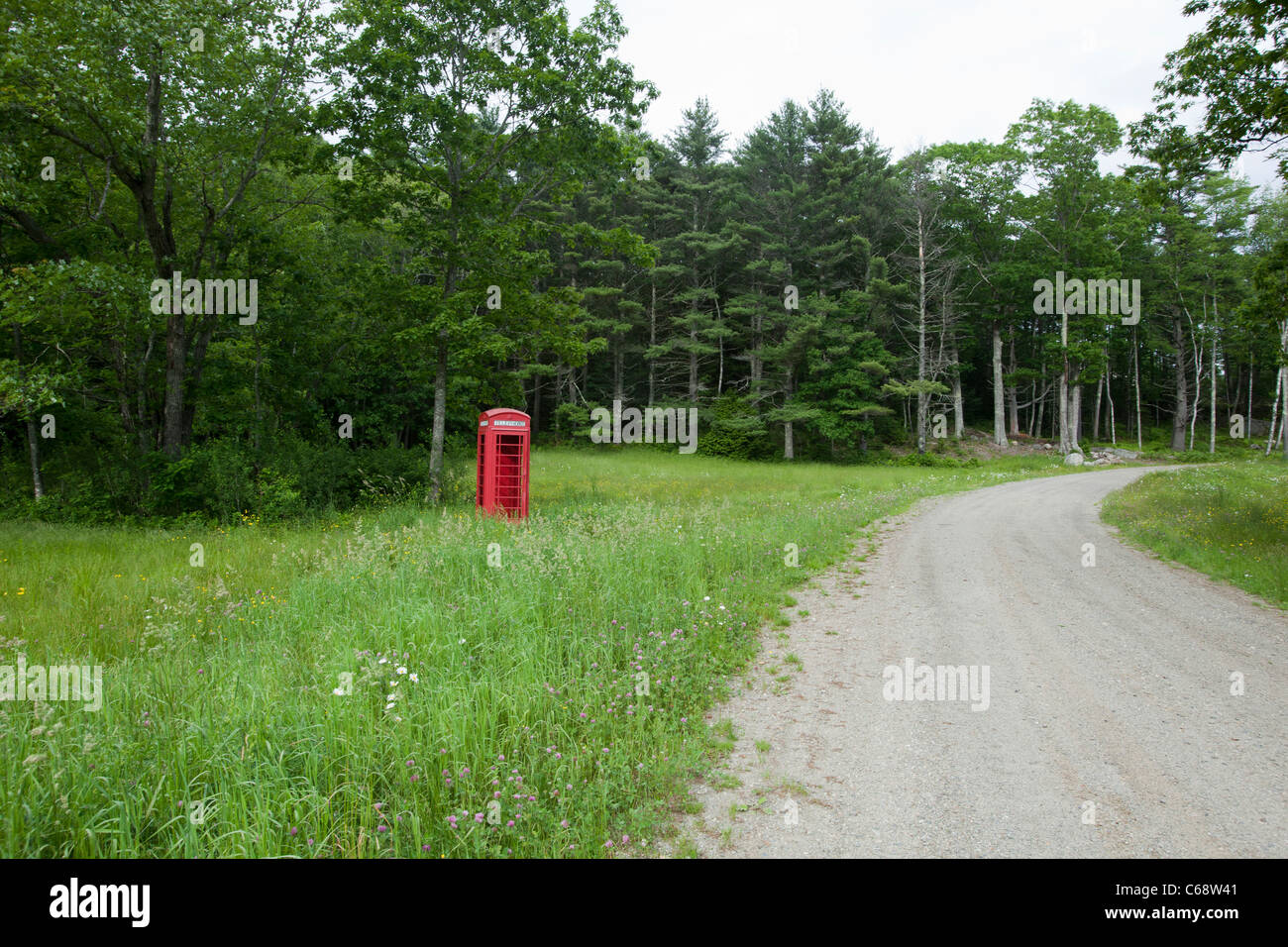 Red British telephone booth in the country Maine Stock Photo - Alamy