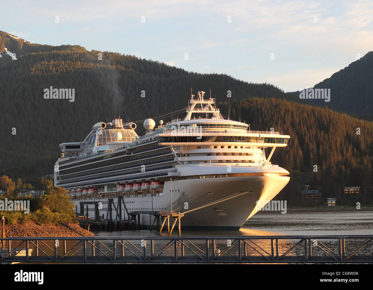 Cruise ship starting to depart from port in Juneau Alaska in the soft ...