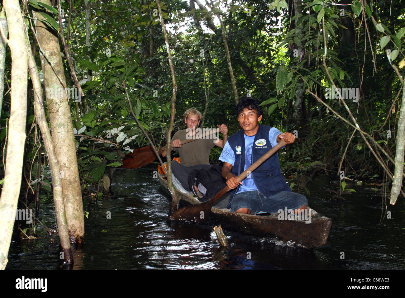 Indigenous guide paddling canoe hi-res stock photography and images - Alamy