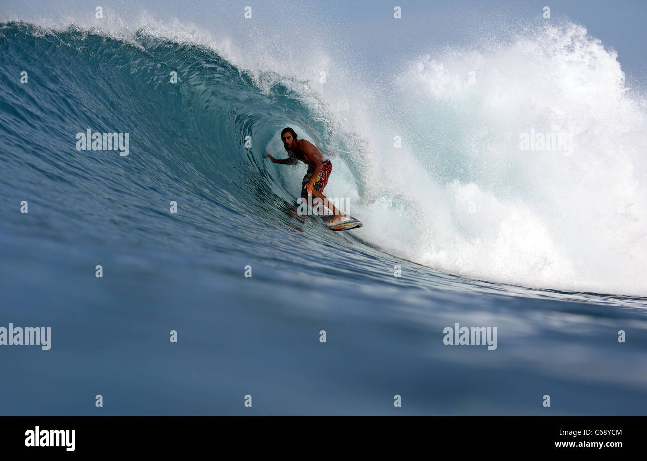 Surfing in the tube on a perfect wave in Sumatra, Indonesia Stock Photo ...