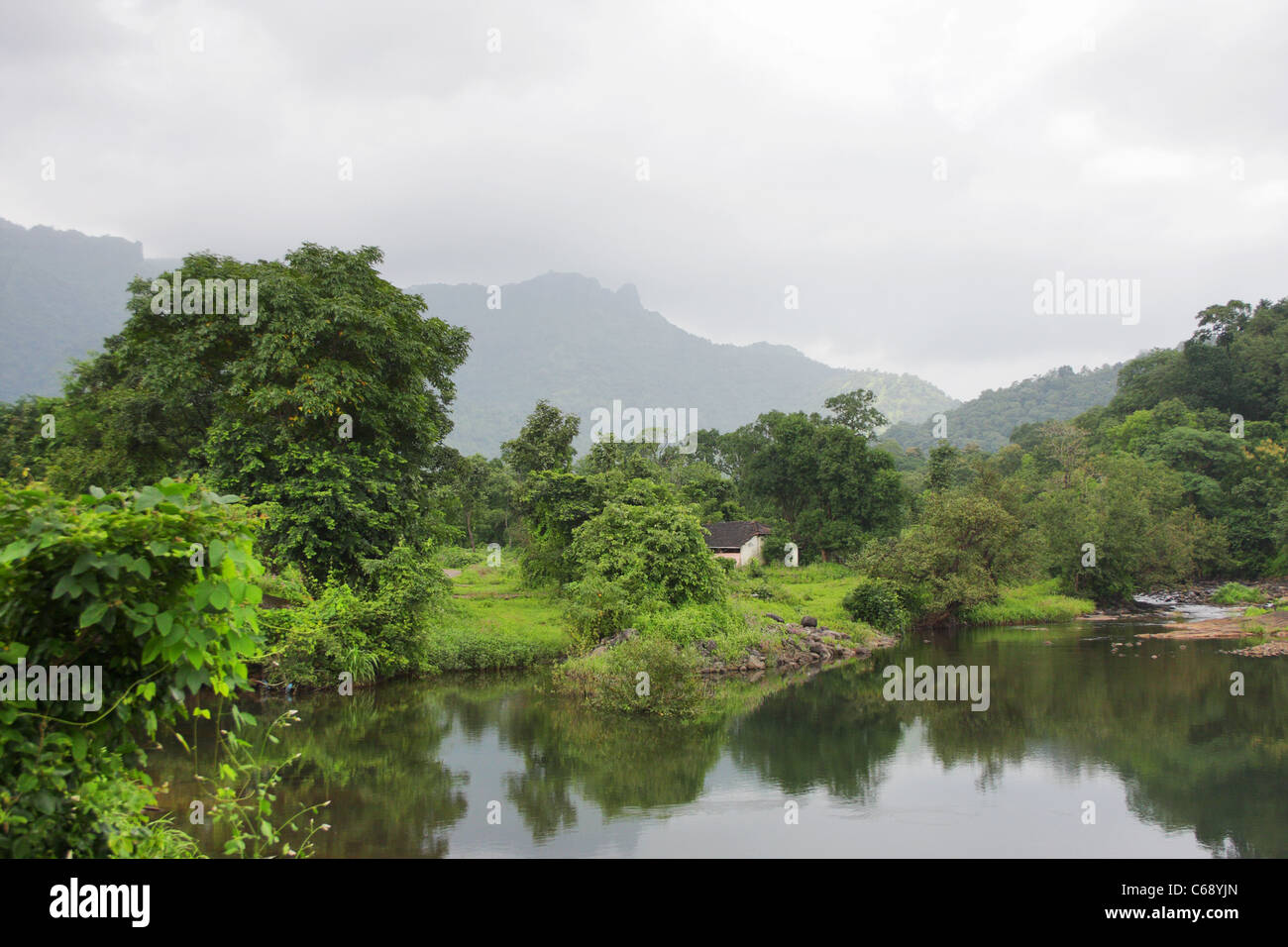 Monsoon Riverscape with Mahuli fort in the backdrop. At Mahuli, Dist ...