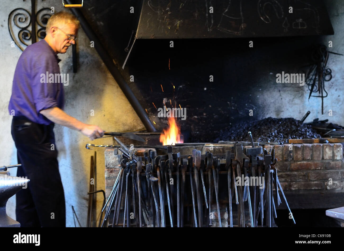 Open Air Museum, Black Smith forging steel Stock Photo - Alamy