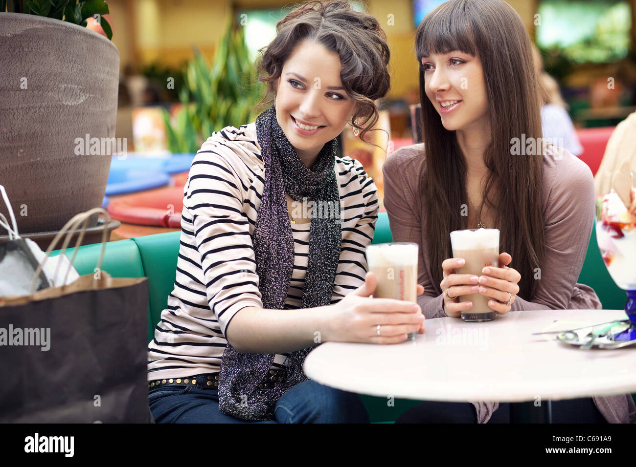 two young girls having lunch break together Stock Photo - Alamy