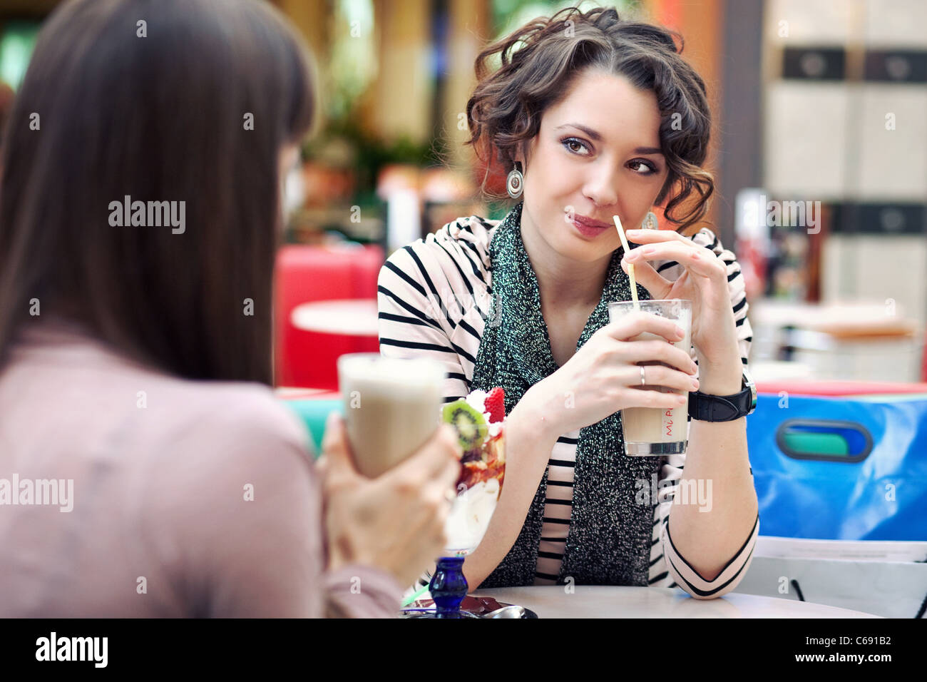 two young girls having lunch break together Stock Photo - Alamy