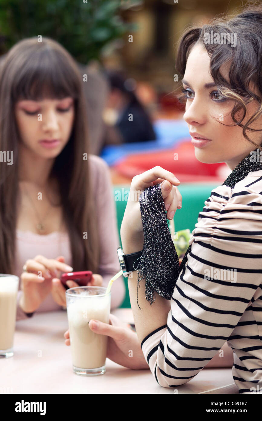 two young girls having lunch break together Stock Photo - Alamy