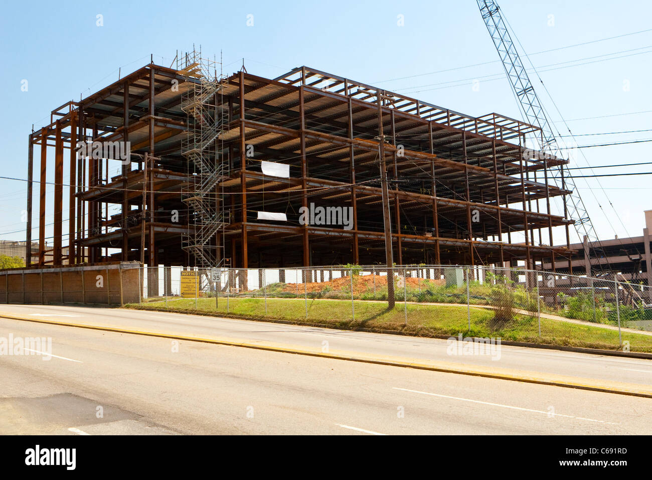 A four-story, steel framed, commercial building construction site in a ...