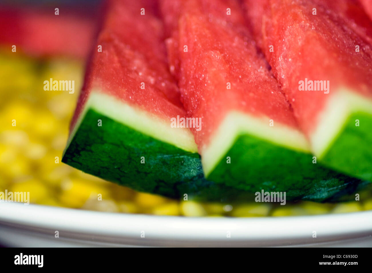 Fresh watermelon slices and maize Stock Photo - Alamy