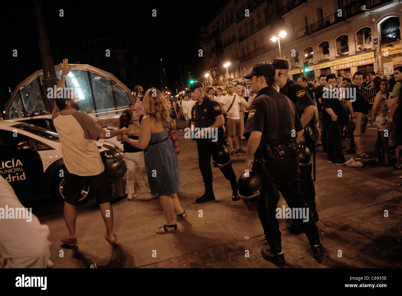 Agressive verbal fight between a lay protester and a policeman Stock ...