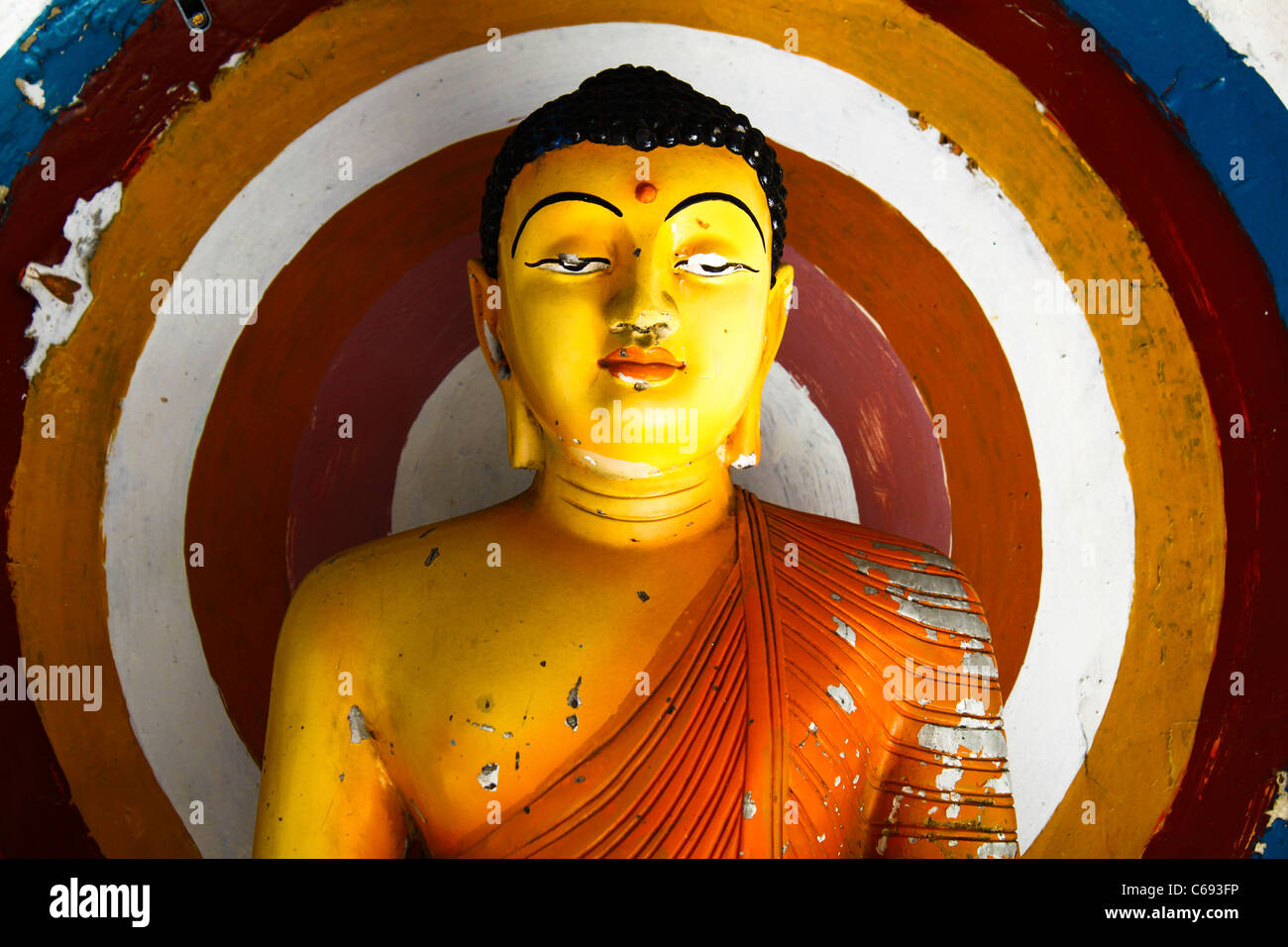 A colourful statue of Buddha Stock Photo - Alamy