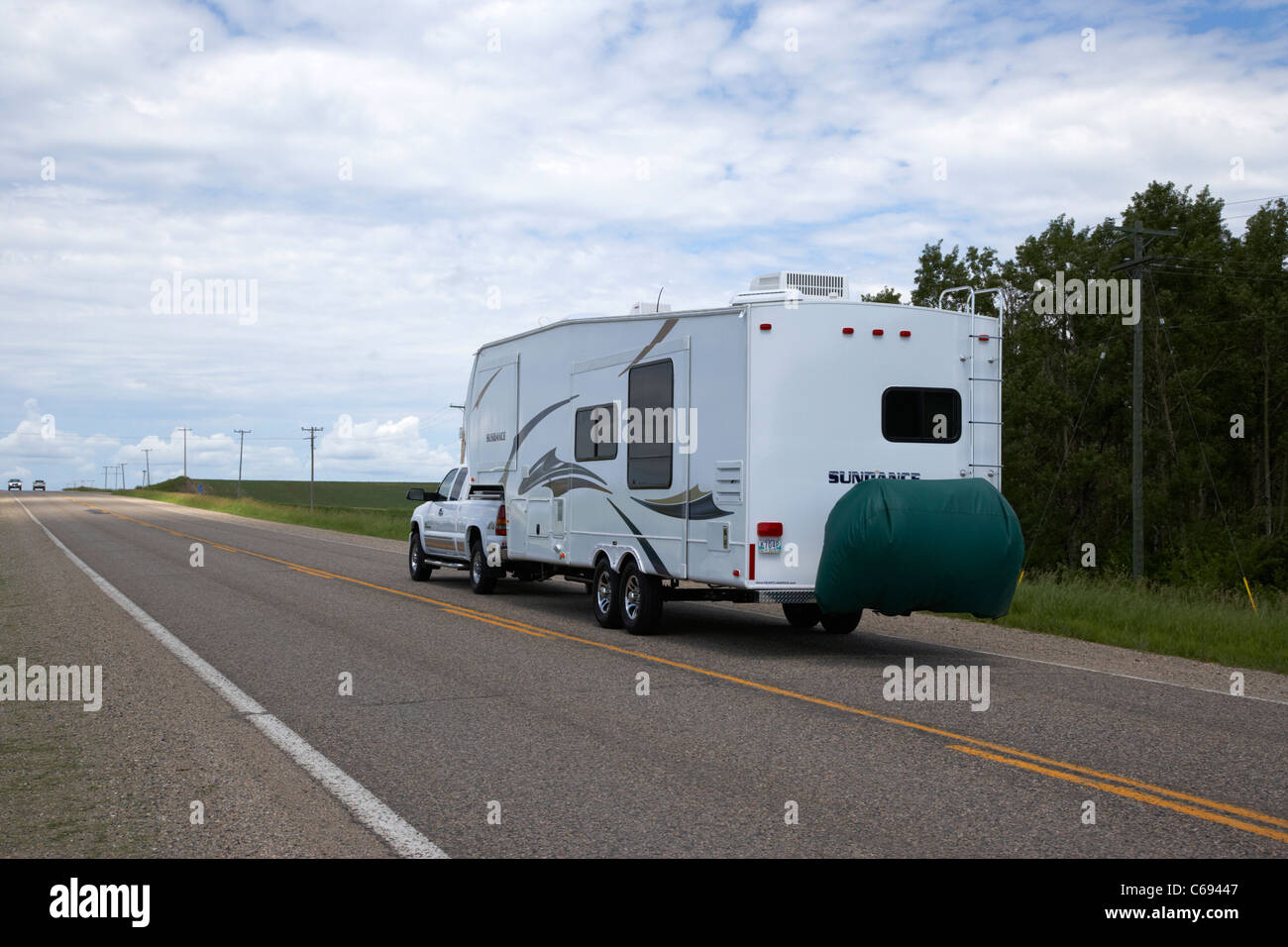 truck towing rv trailer along route highway 10 near wasagaming Manitoba ...