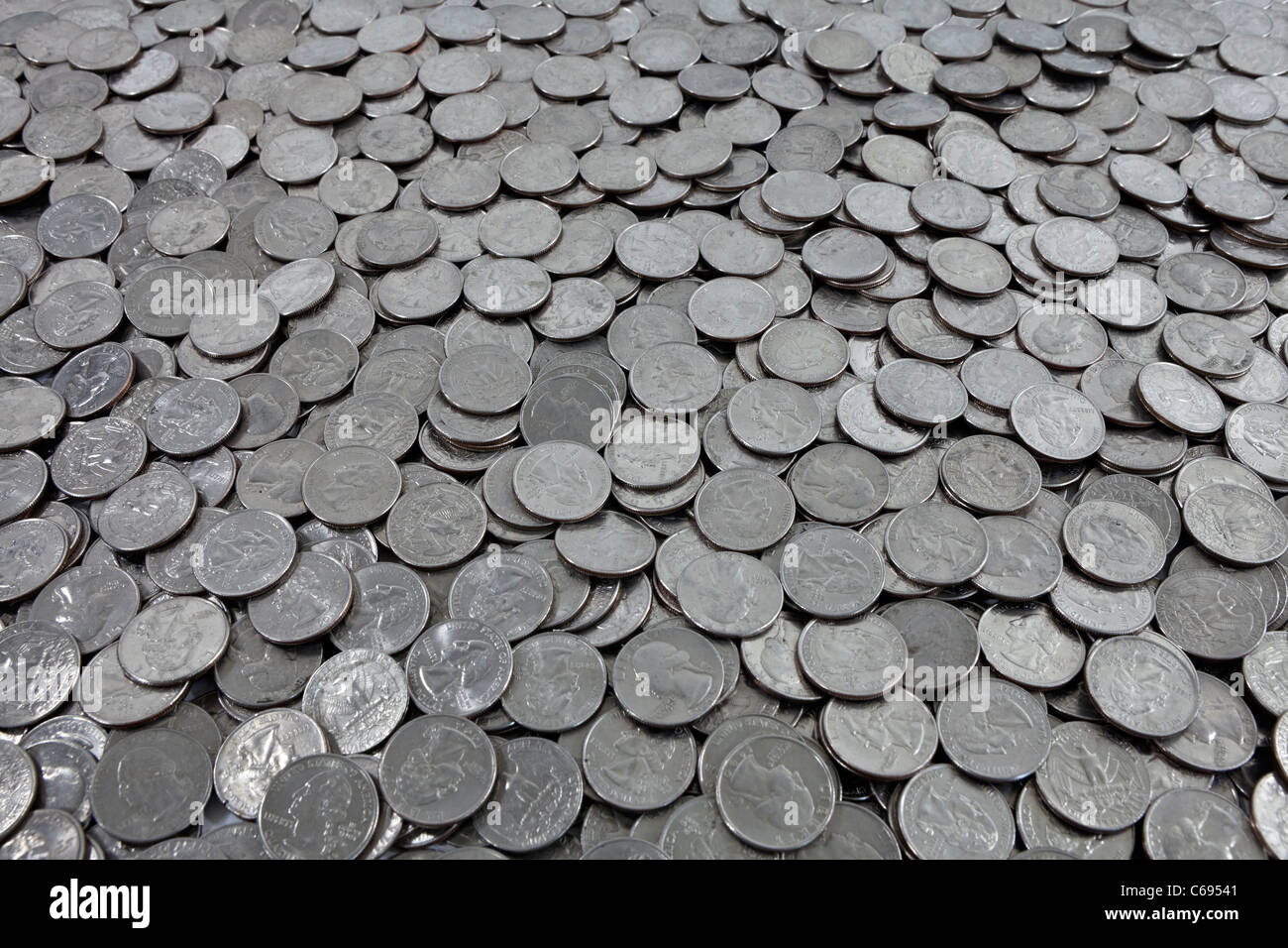 US quarters background. Newer "States" quarters are face up to avoid ...