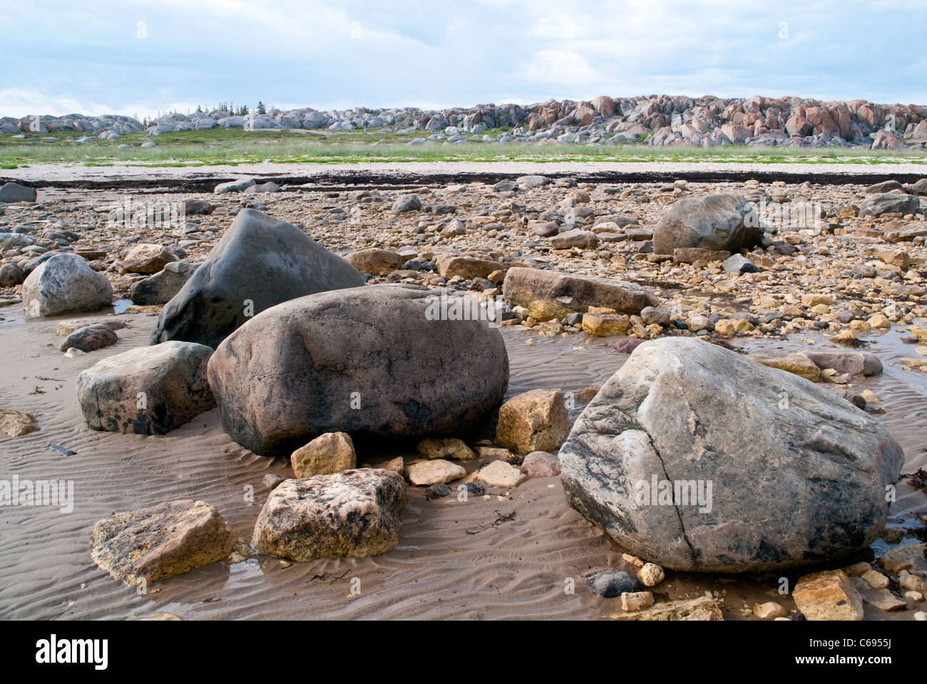 Rocky tundra terrain along the west coast of Hudson Bay at low tide, at ...