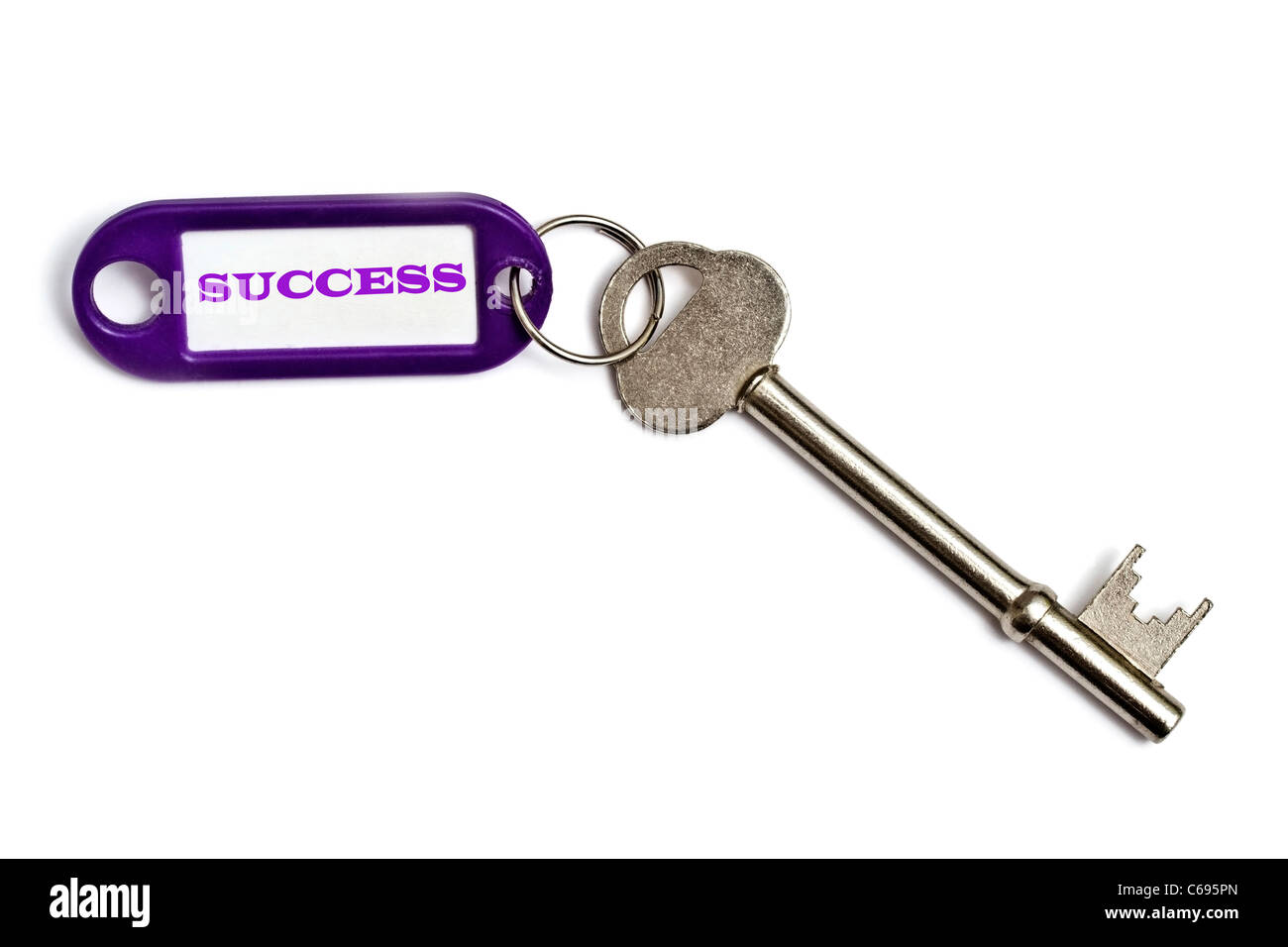 Key with a success tag closeup on white background Stock Photo - Alamy