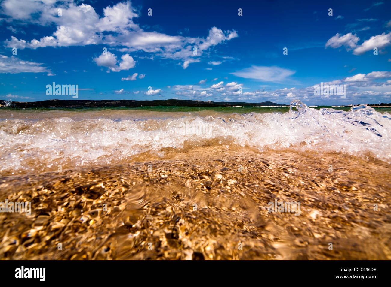 small wave on the beach Stock Photo - Alamy