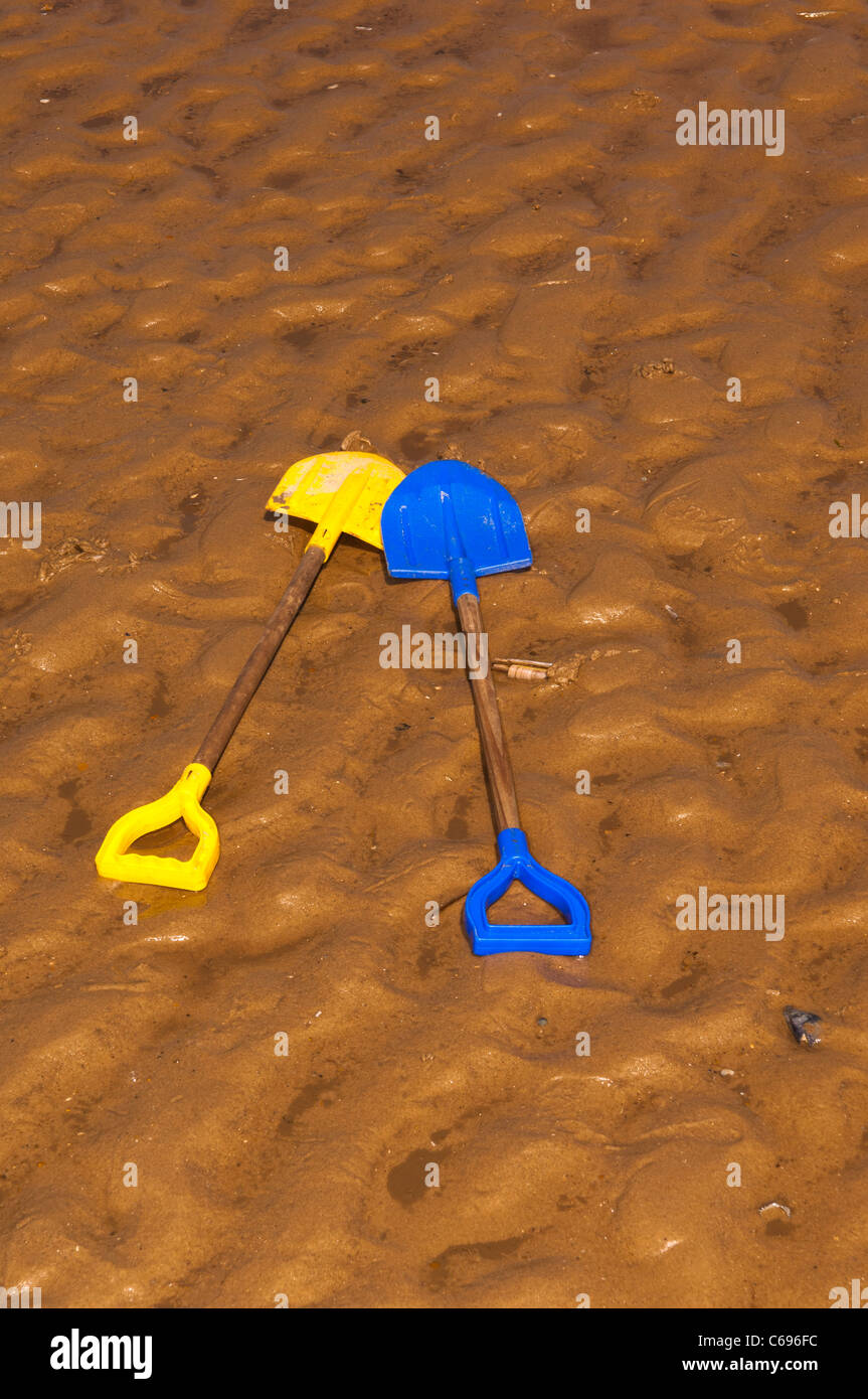 Colourful childrens spades on the beach at Wells-next-the-sea , Norfolk ...