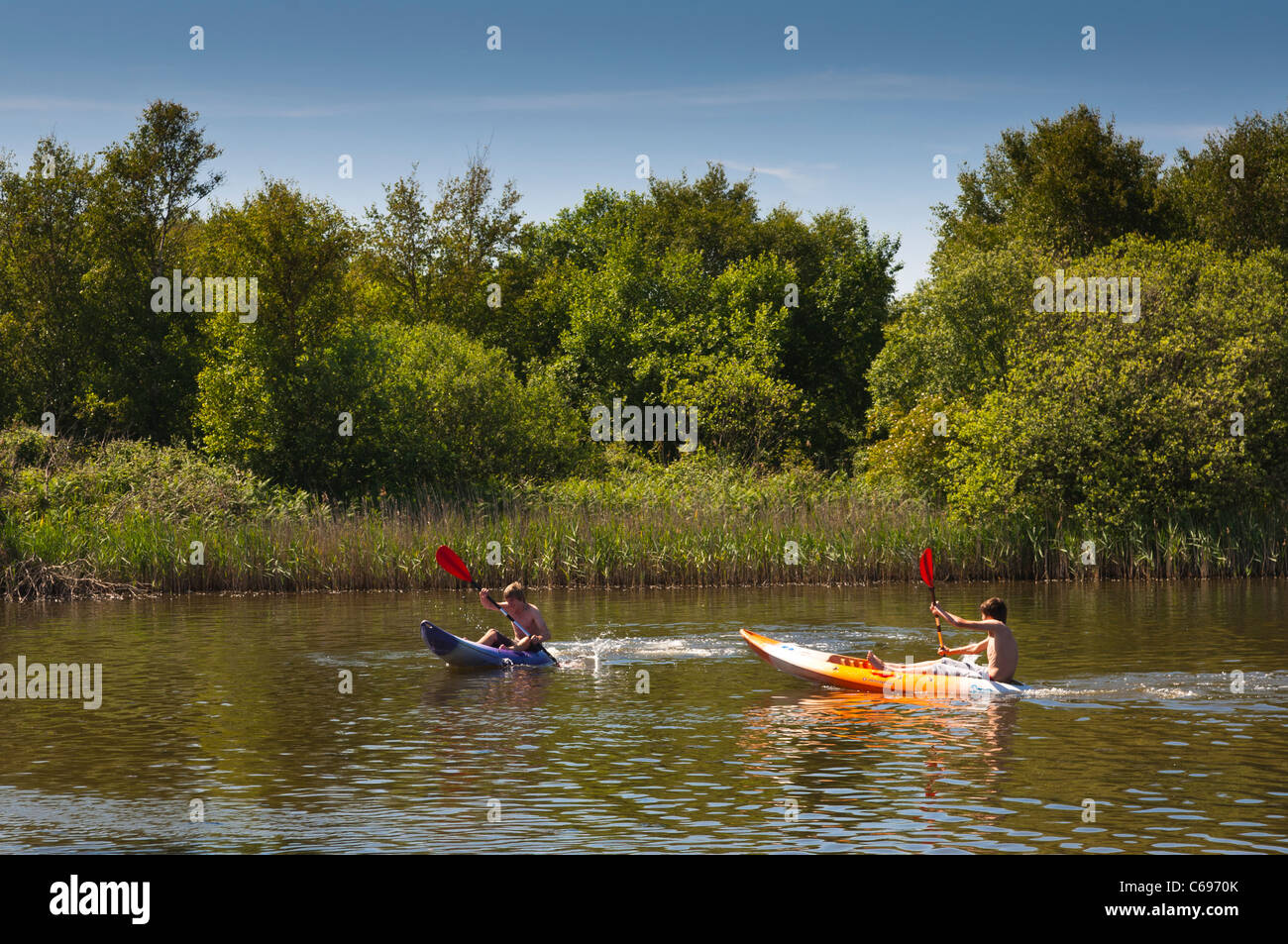 Children in canoes hi-res stock photography and images - Alamy