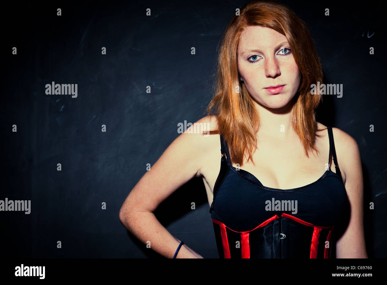 Redhead woman looking very serious Stock Photo - Alamy