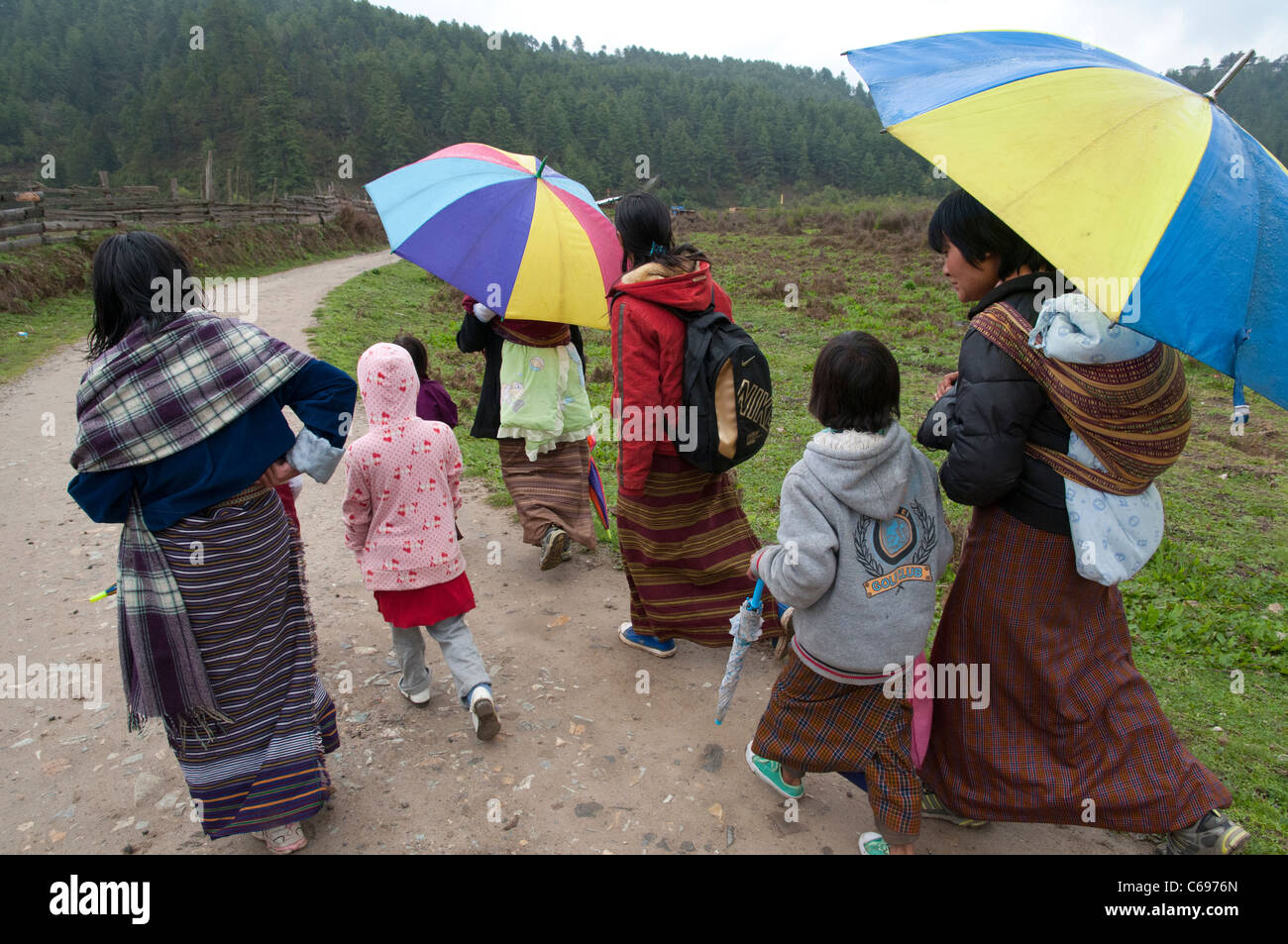 farmers family on a trail in Phobjikha valley. Bhutan Stock Photo - Alamy