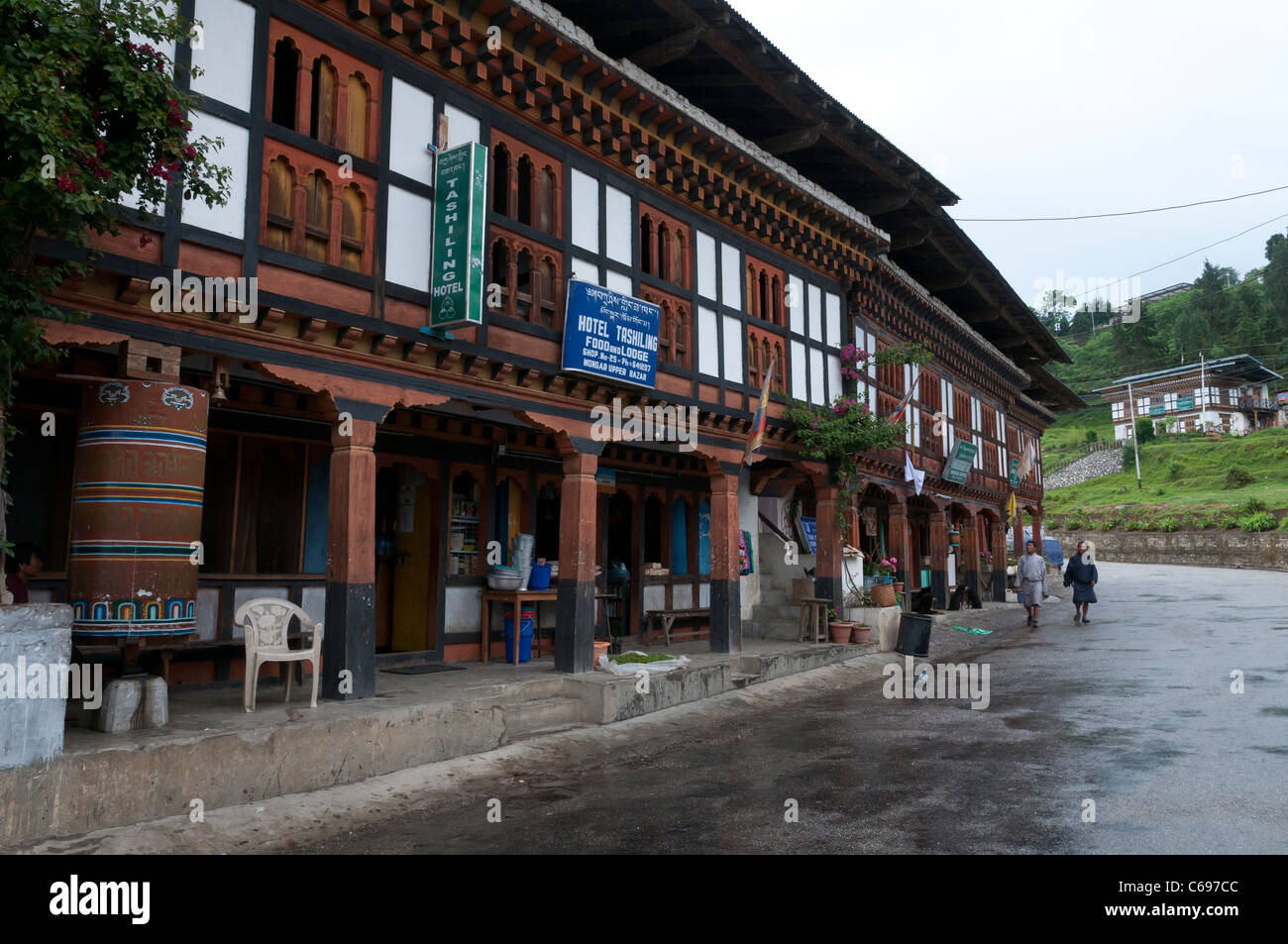 traditional buildings along a street in Mongar. Bhutan Stock Photo - Alamy