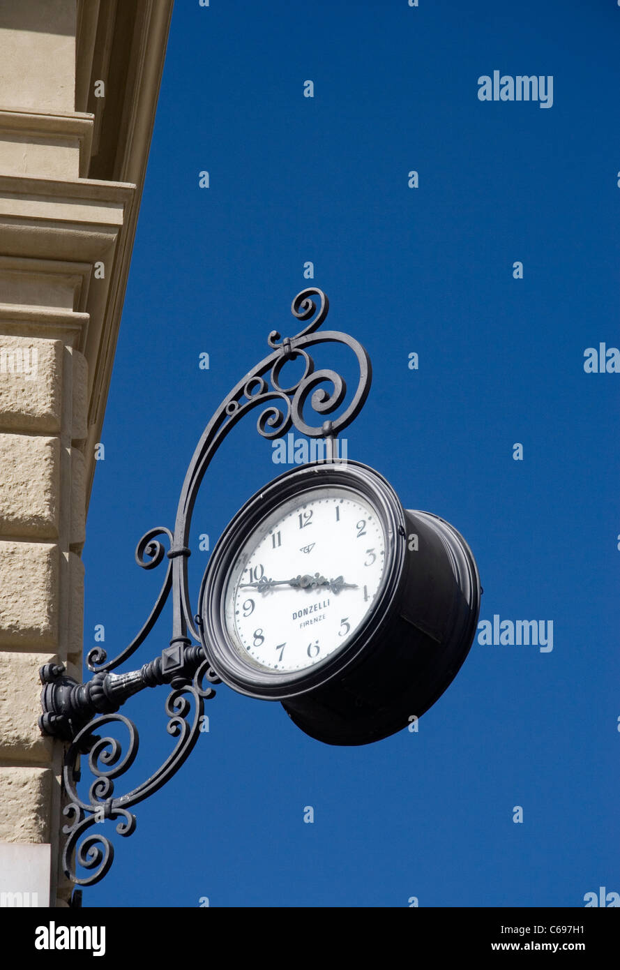 Ornate wall clock on Via Roma, near Piazza del Duomo, Florence, Italy ...