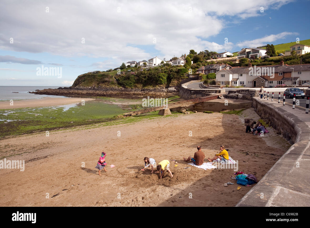 The beach and harbour wall at Portmellon, Cornwall, SW UK Stock Photo ...
