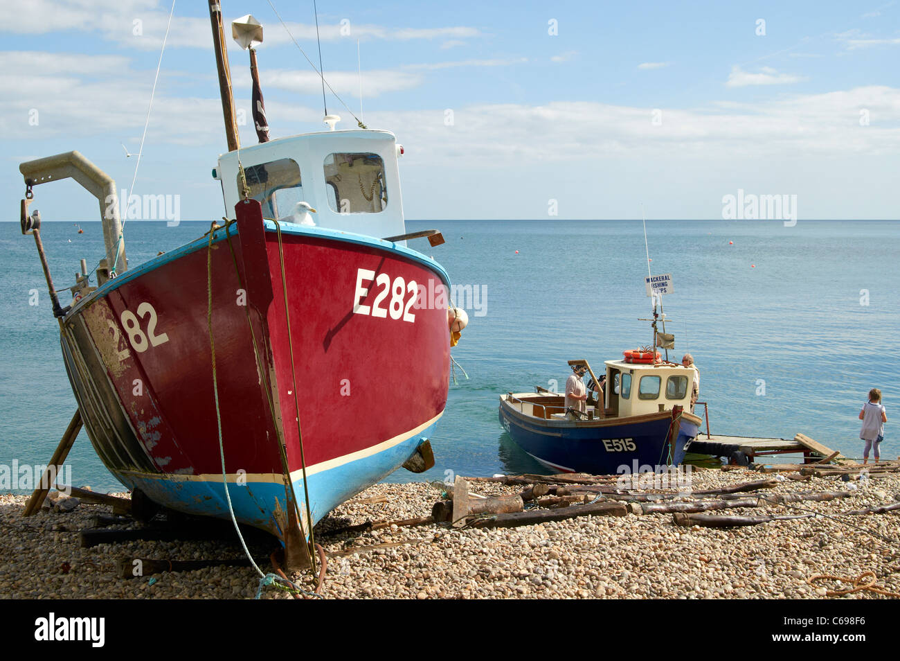 The beach at Beer, Devon, England with fishing boats, crab pots and ...