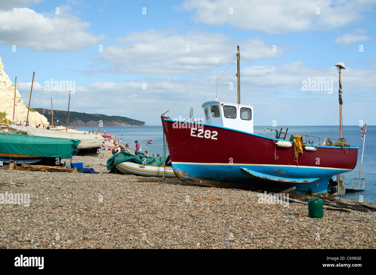 The beach at Beer, Devon, England with fishing boats, crab pots and ...