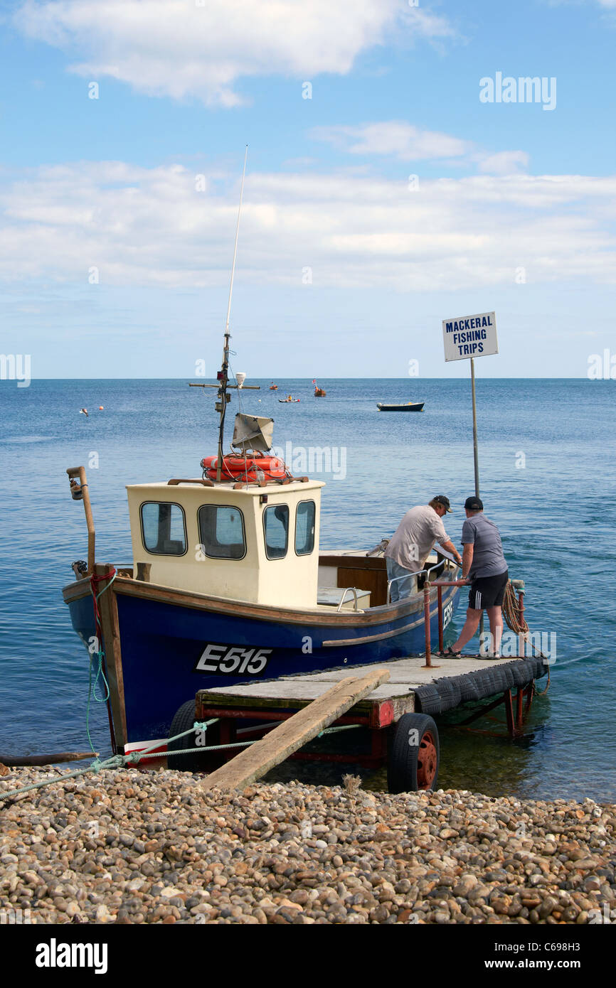 The beach at Beer, Devon, England with fishing boats, crab pots and ...