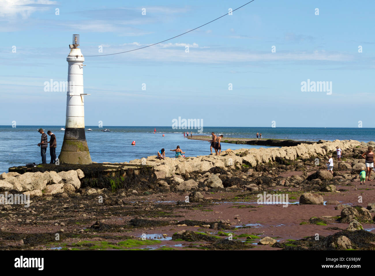 The small lighthouse on the entrance to the Teign estuary during low ...