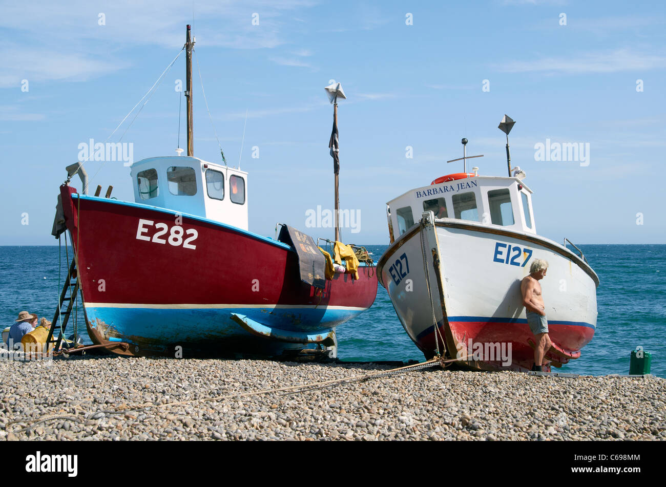 The beach at Beer, Devon, England with fishing boats, crab pots and ...