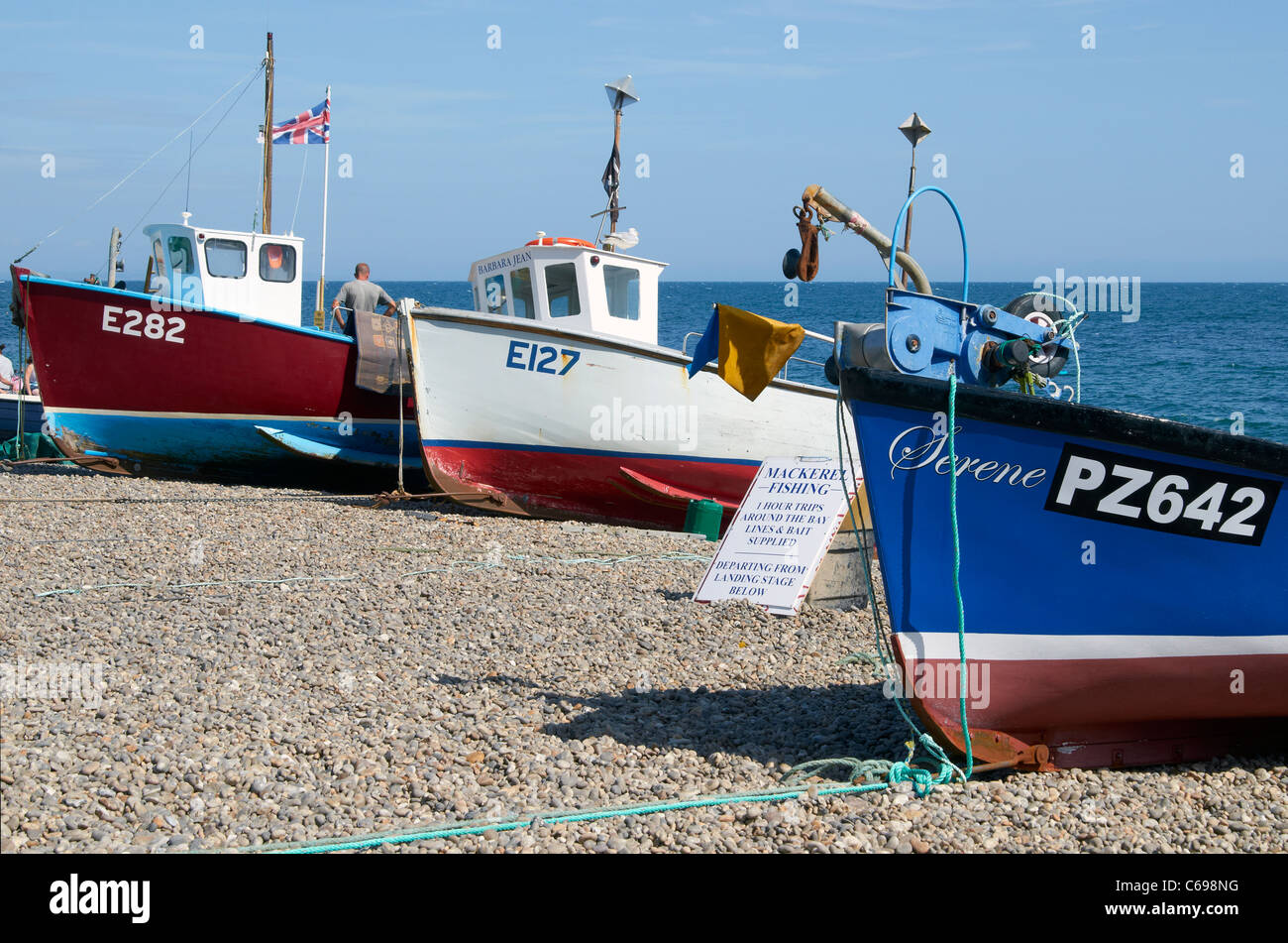 The beach at Beer, Devon, England with fishing boats, crab pots and ...