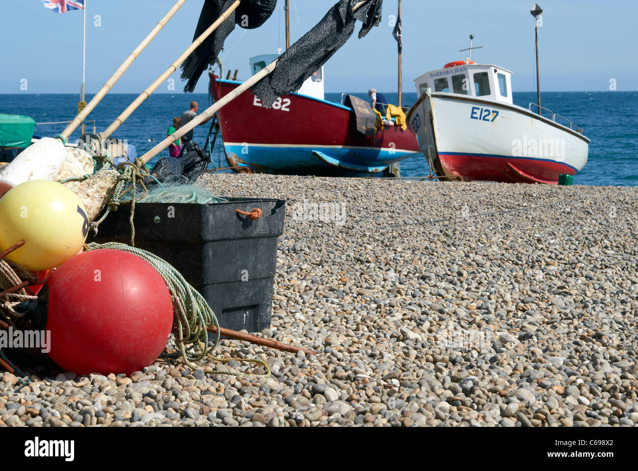 The beach at Beer, Devon, England with fishing boats, crab pots and ...