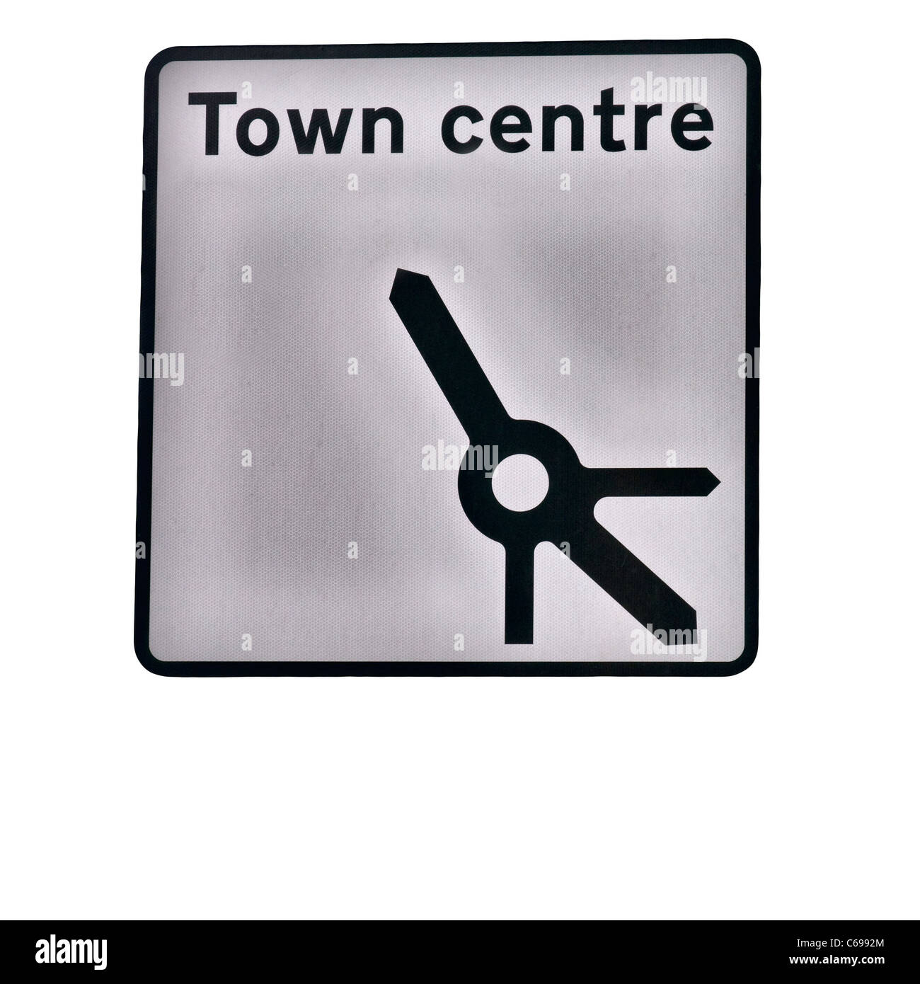 Road sign pointing to the town centre (includes roundabout detail) cut ...