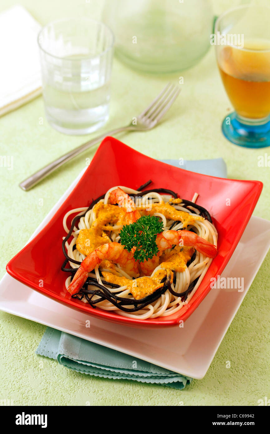 Spaghetti nests with seaweeds and sauce. Recipe available Stock Photo ...