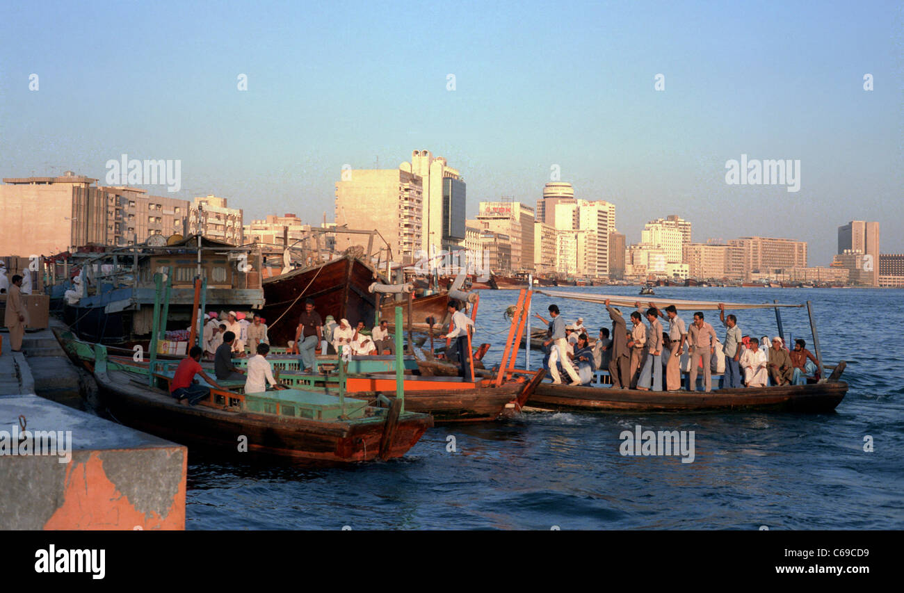 Commuters crossing the Creek by abra, Dubai, 1984 Stock Photo - Alamy