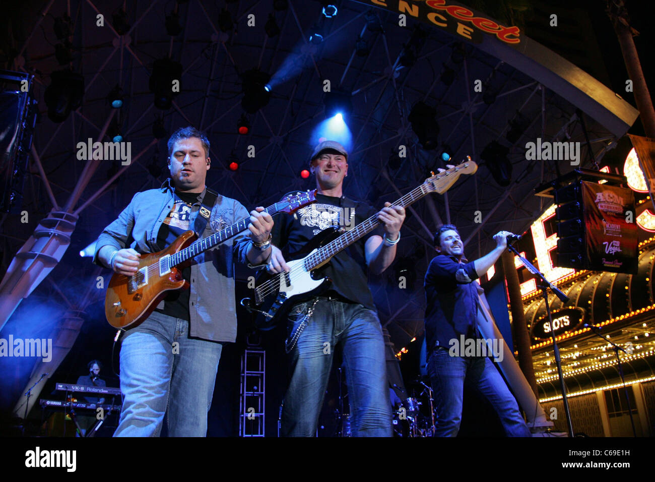 Band members, Chris Young (right) on stage for ACM Concerts at Fremont ...