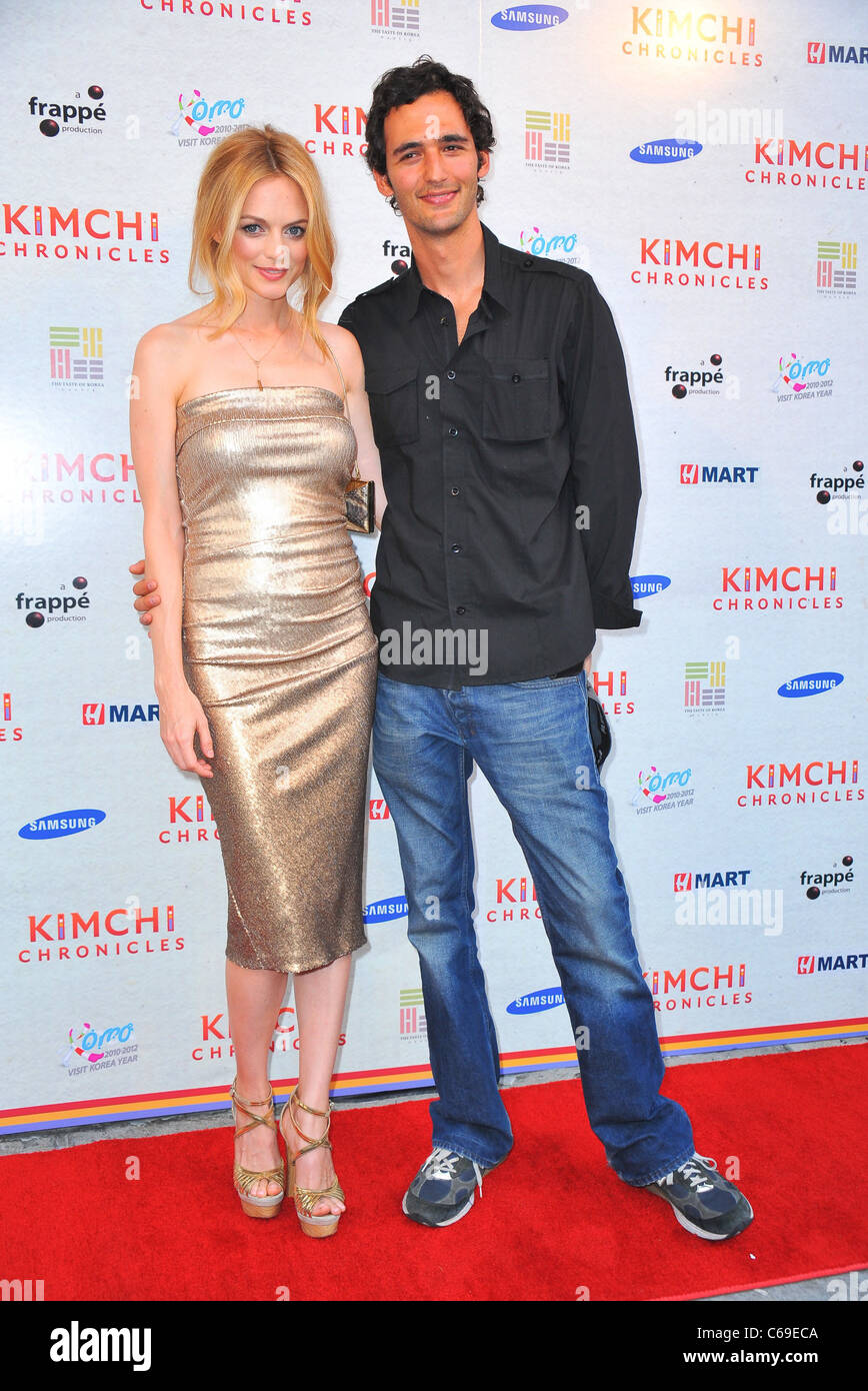 Heather Graham (wearing a Donna Karan dress and shoes), Jason Silva at ...