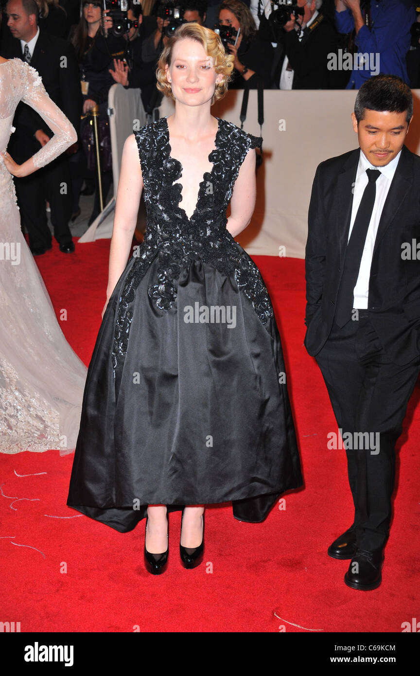 Mia Wasikowska (wearing a Thakoon dress), Thakoon Panichgul at arrivals for Alexander McQueen ...