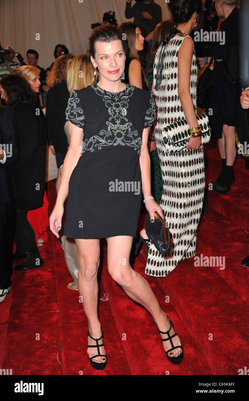 Milla Jovovich (wearing a dress by Marni) at arrivals for Alexander ...