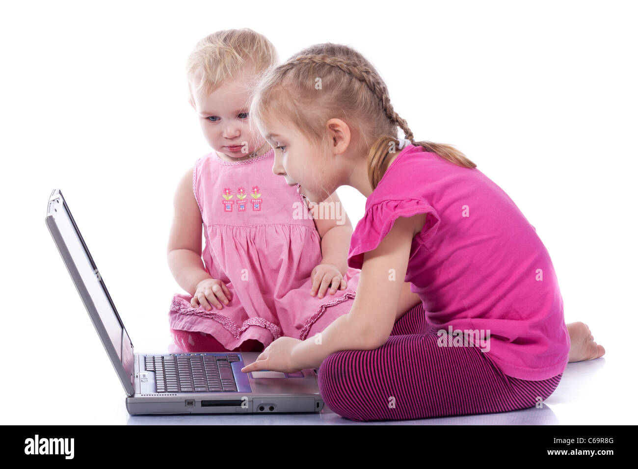 Kids playing computer game on laptop isolated on white Stock Photo - Alamy