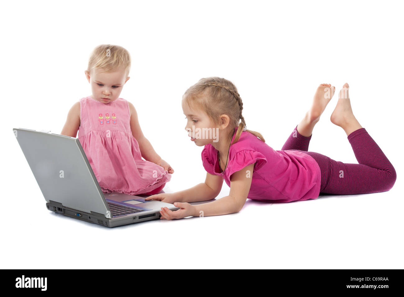 Kids playing computer game on laptop isolated on white Stock Photo - Alamy
