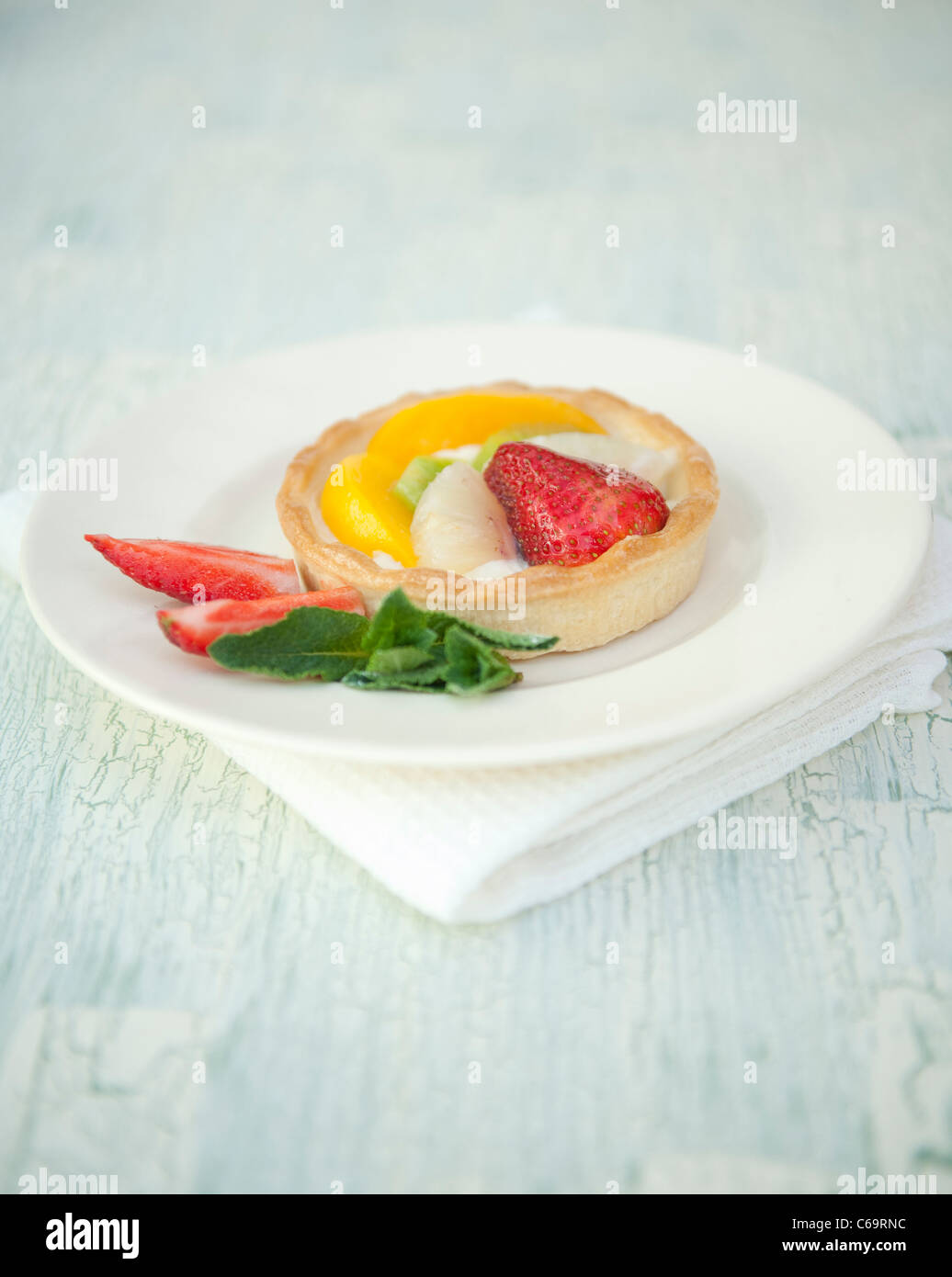 Home made fruit tartlet with strawberries and mint Stock Photo - Alamy