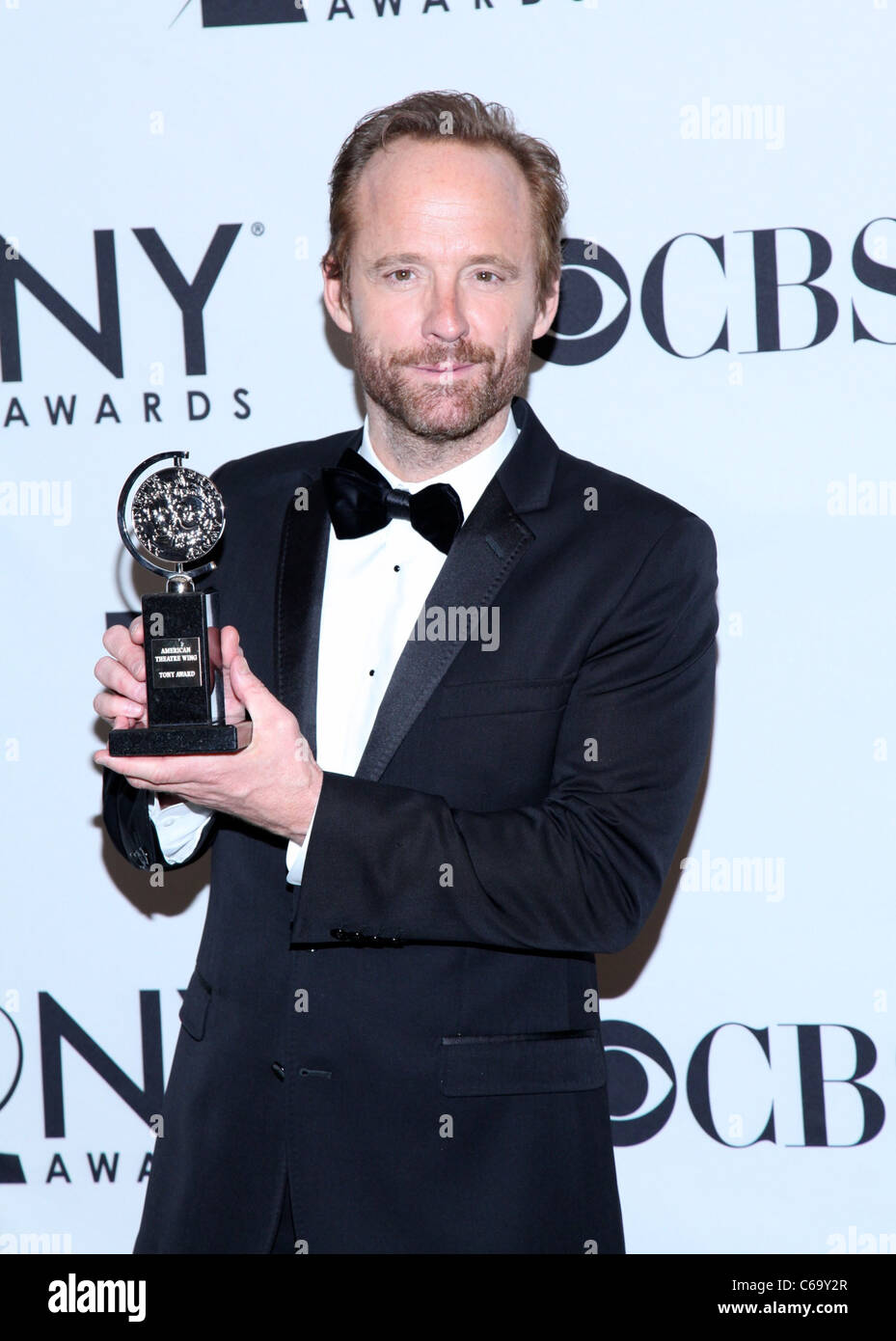 John Benjamin Hickey in the press room for American Theatre Wing's 65th ...