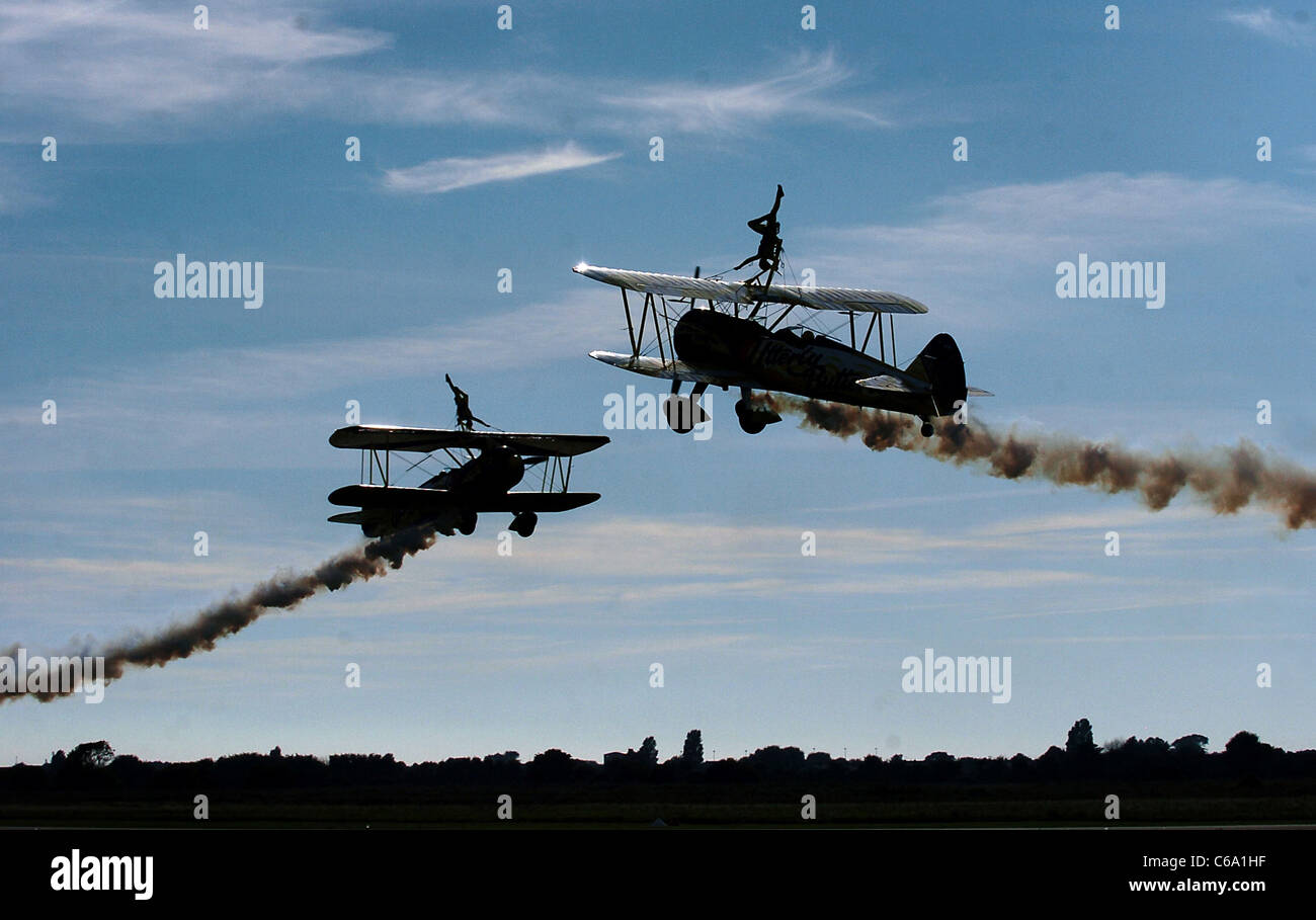 The Utterly Butterly Wing Walking Display team pass by each other at ...