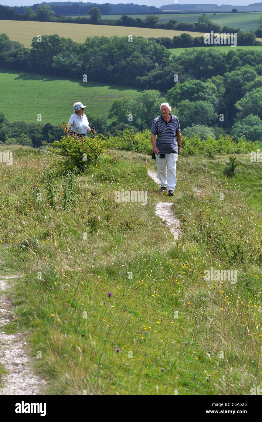 Two walkers enjoying stunning views on Hod Hill, an iron age hill fort ...