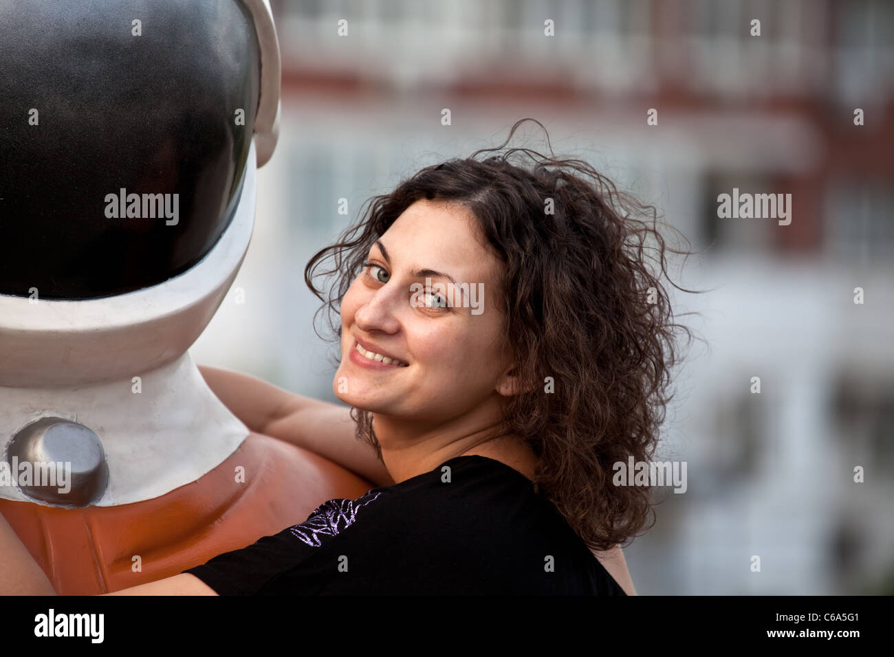 Young pretty lady hug artificial astronaut Stock Photo - Alamy